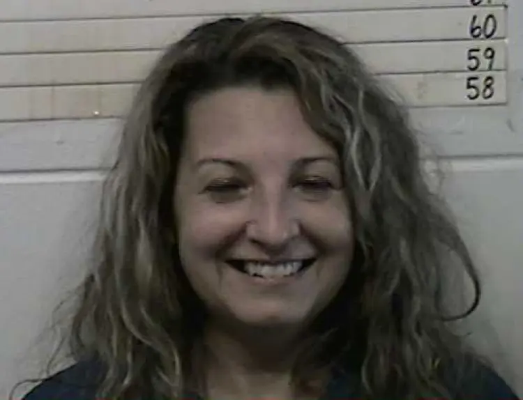 Oklahoma Woman Smiles for Police Mugshot After Allegedly Stabbing ...