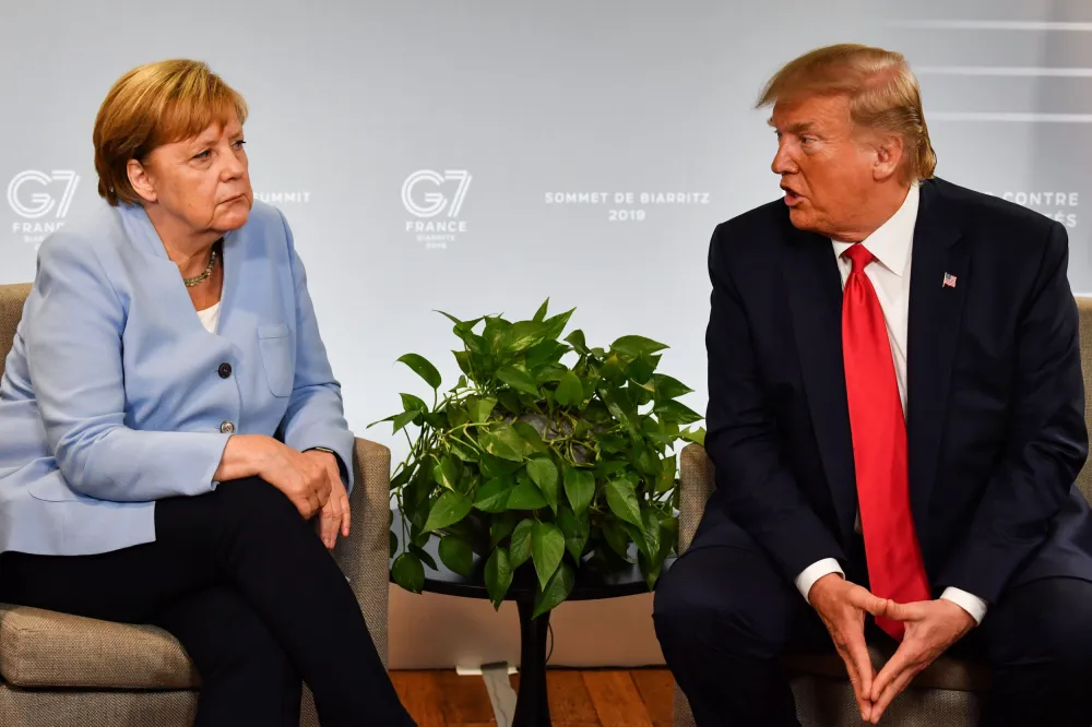 Donald Trump Called Angela Merkel ‘That B****’ and ‘Kraut’: Book - Newsweek