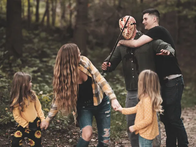 Family Pose for Murder-Themed Photo Shoot Featuring a Bloody Jason ...