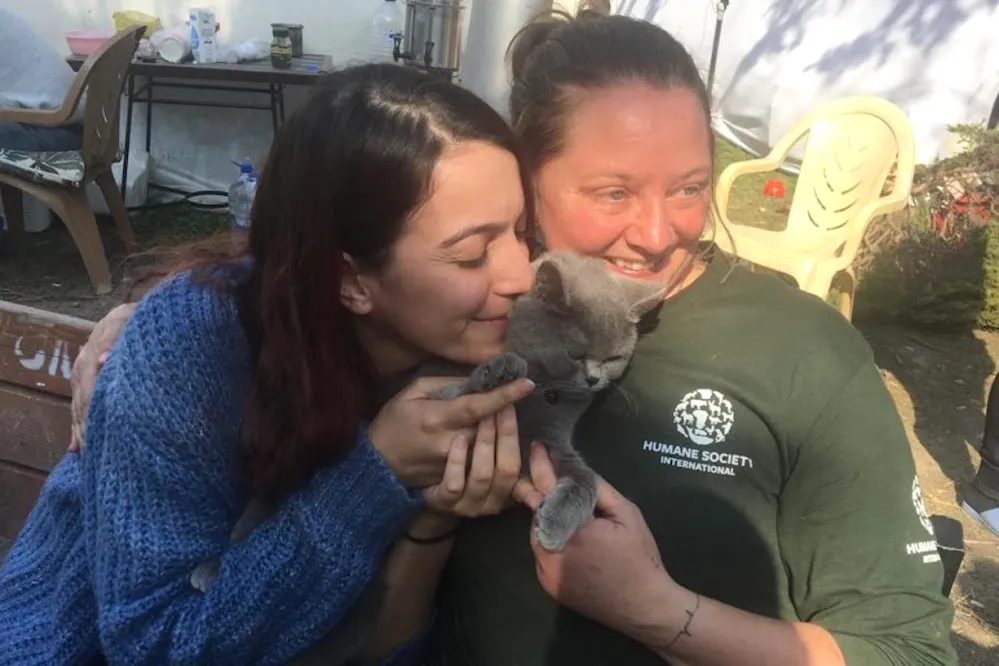 Watch Woman Who Survived Earthquake Reunite With Cat That Saved Her ...