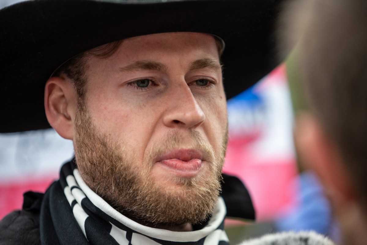 Alex Jones’ Co-Host In Prison Lockdown ’23 Hours a Day’ - Newsweek