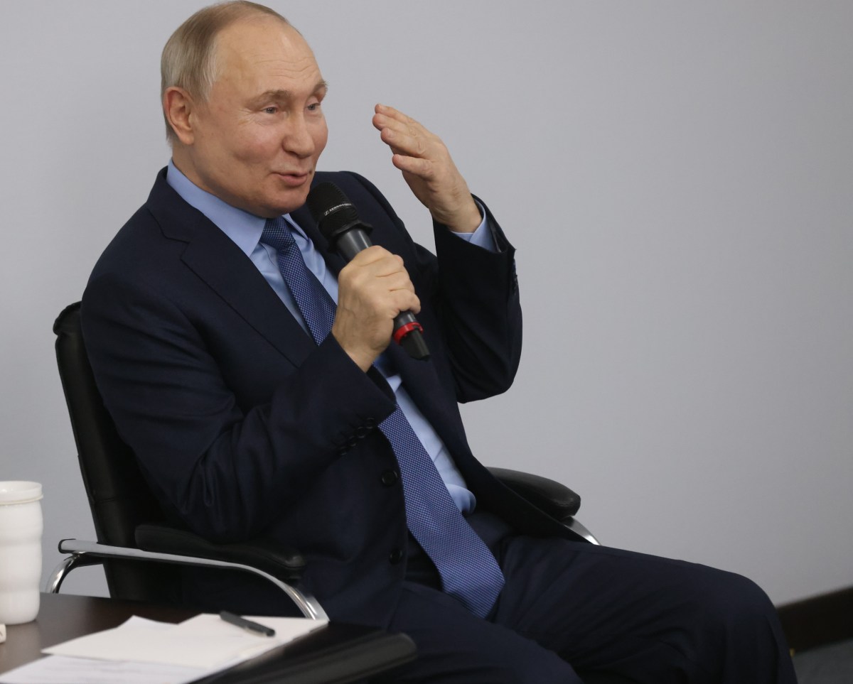 Video of Putin ‘Clinging to the Chair’ During Event Viewe... - Newsweek