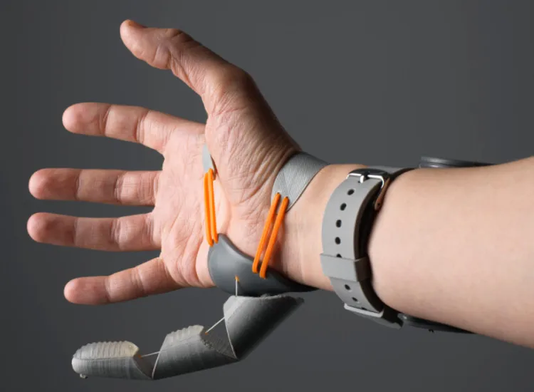 Researchers Develop Robotic ‘Third Thumb’ for One-Handed Tasks - Newsweek