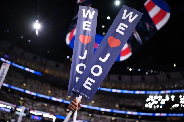 Protester Hit With ‘We Love Joe’ Sign During Biden’s DNC Speech - Newsweek