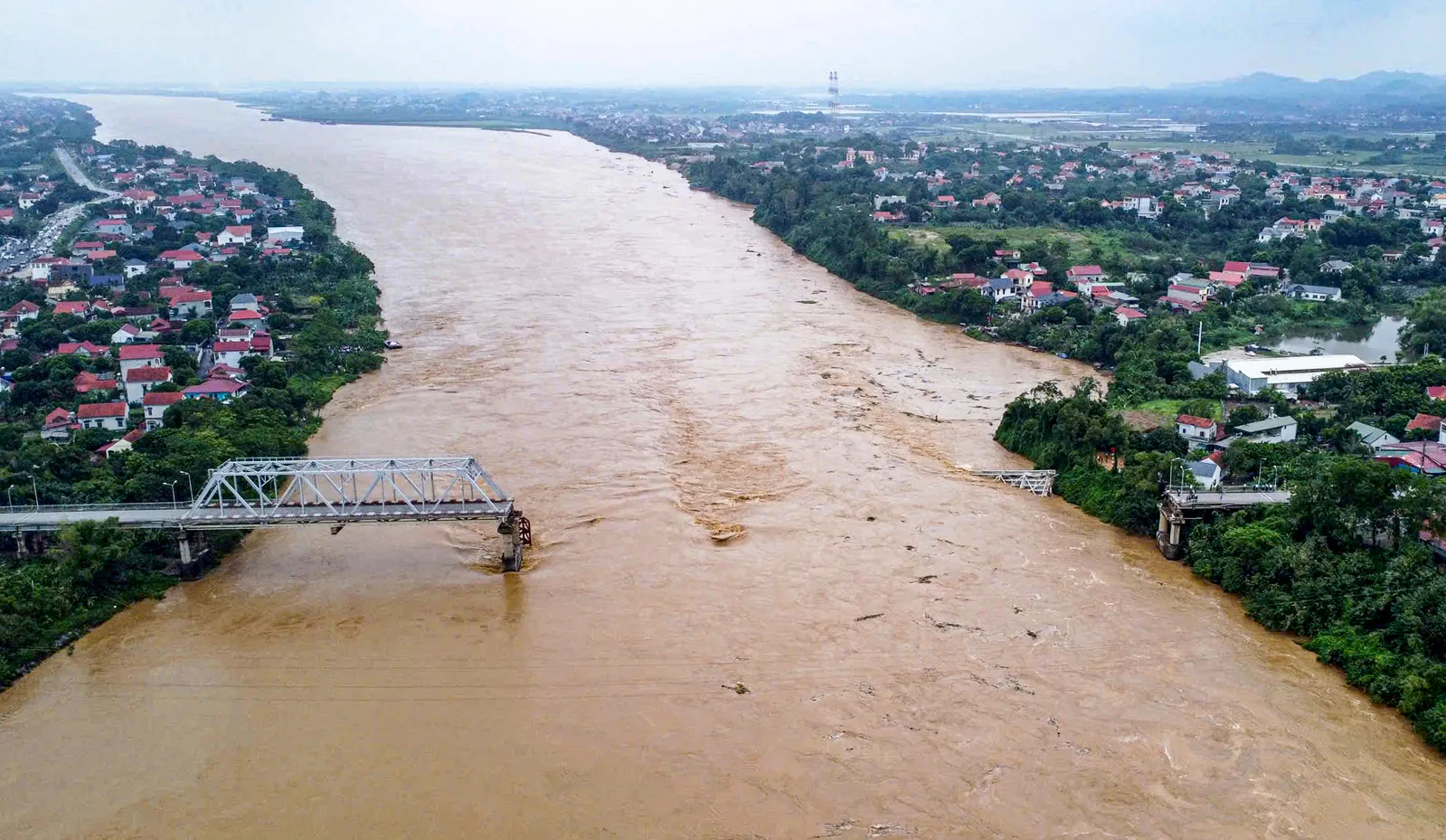 Vietnam Bridge Collapse and Flash Flooding Leave At Least 59 Dead ...