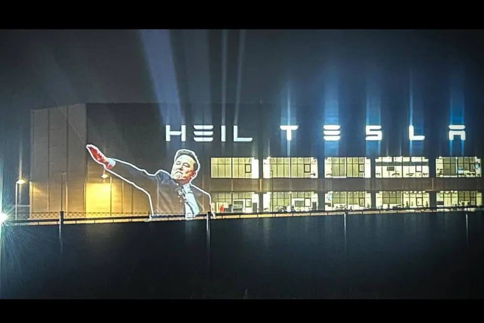 Elon Musk Controversial Salute Image Beamed on Tesla Factory in Berlin ...