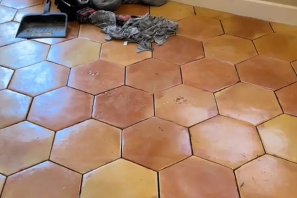 Woman Redoing Kitchen Floor Looks at Tiles, Notices Something is ...