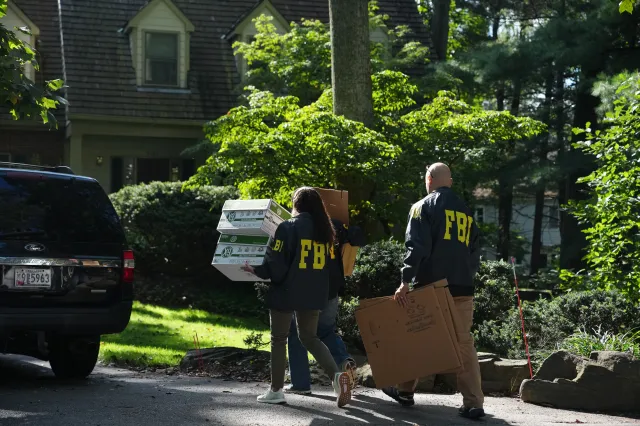 FBI Agents Exit John Bolton’s Office With Boxes in Raid - Newsweek