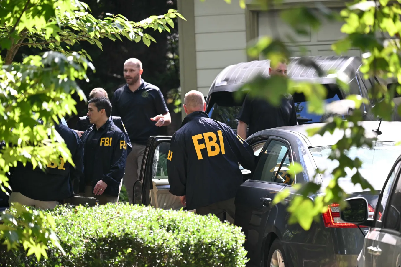 FBI Agents Exit John Bolton’s Office With Boxes in Raid - Newsweek
