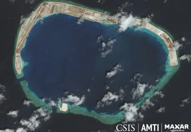 Satellite Photos Show China Turning Artificial Island Into Military ...
