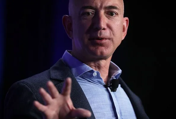 Robot Dogs Are a Thing: Jeff Bezos Takes One for a Walk - Newsweek