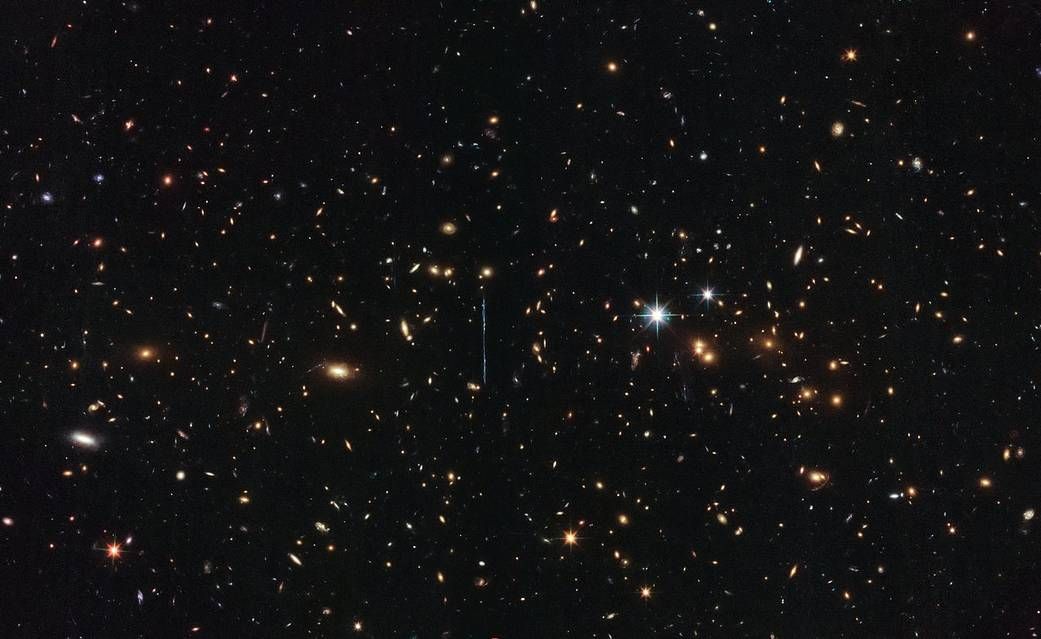 NASA Photo From Hubble Reveals Largest Galaxy Cluster Ever Discovered ...