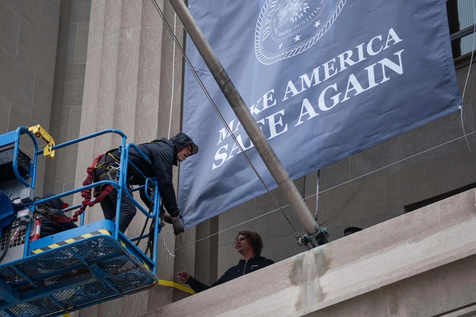 New pro-Trump banner appears at DOJ headquarters - Newsweek