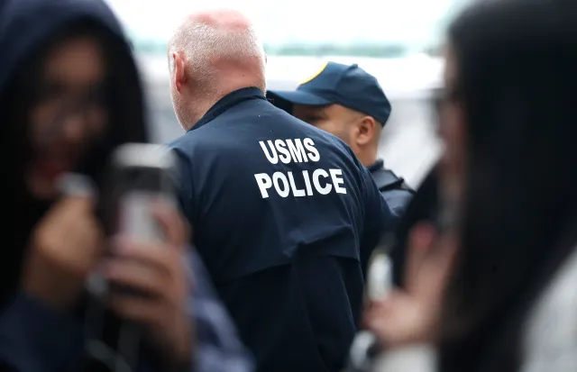 US Marshals Defend Officer Kicking Dog - Newsweek