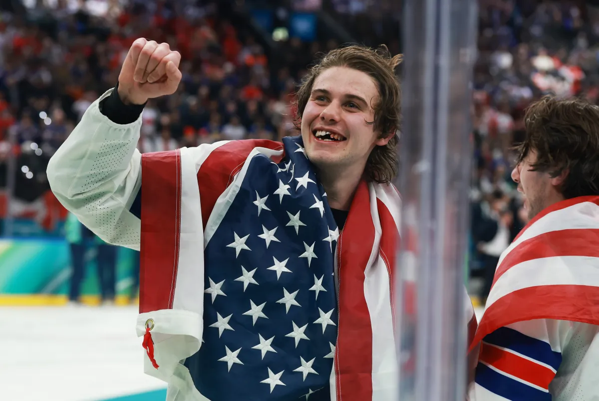 Photo of Toothless USA Star Jack Hughes Goes Viral After Gold Medal ...