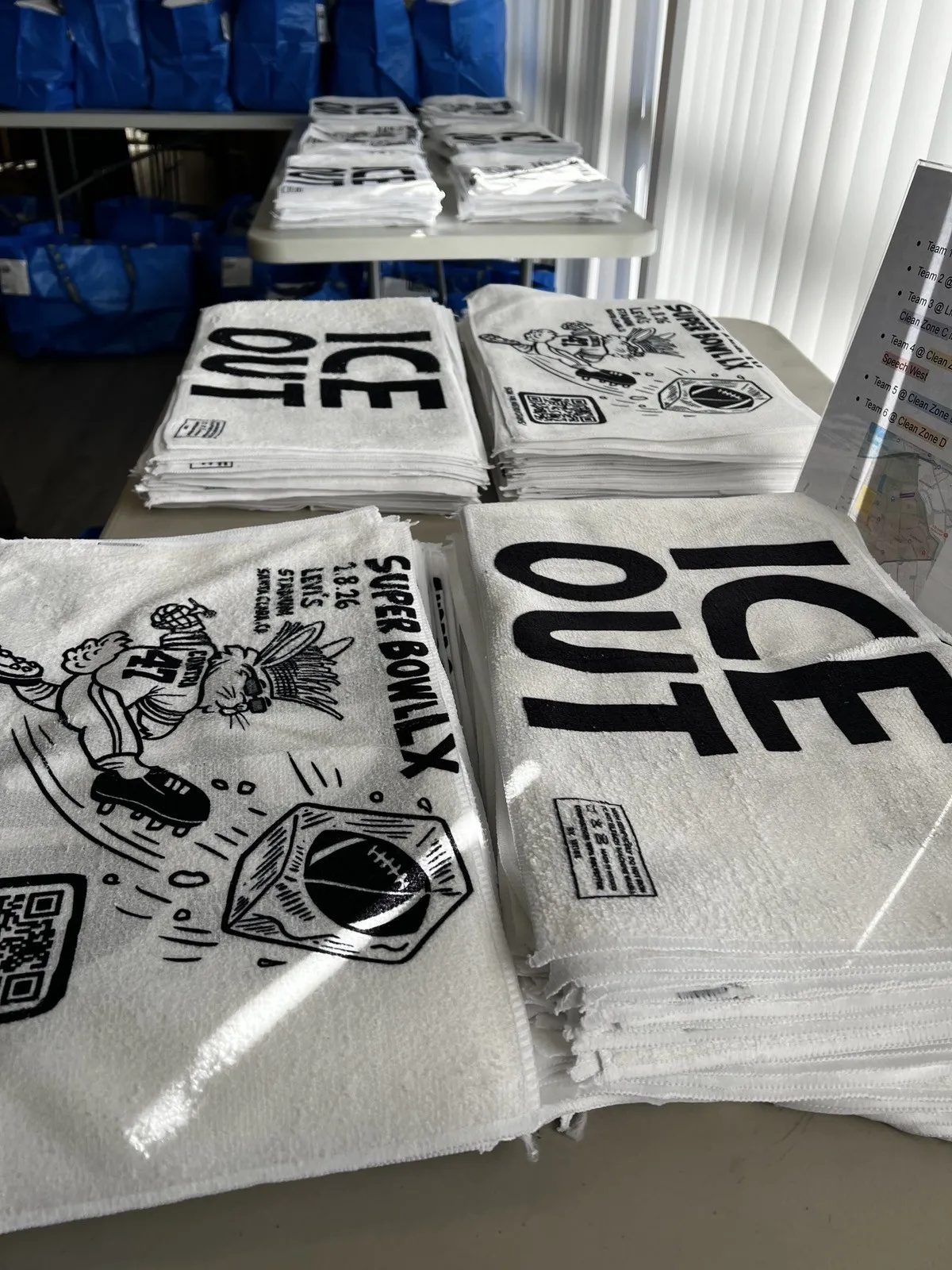 Activists Hand Out ‘ICE OUT’ Towels at Super Bowl LX - Newsweek